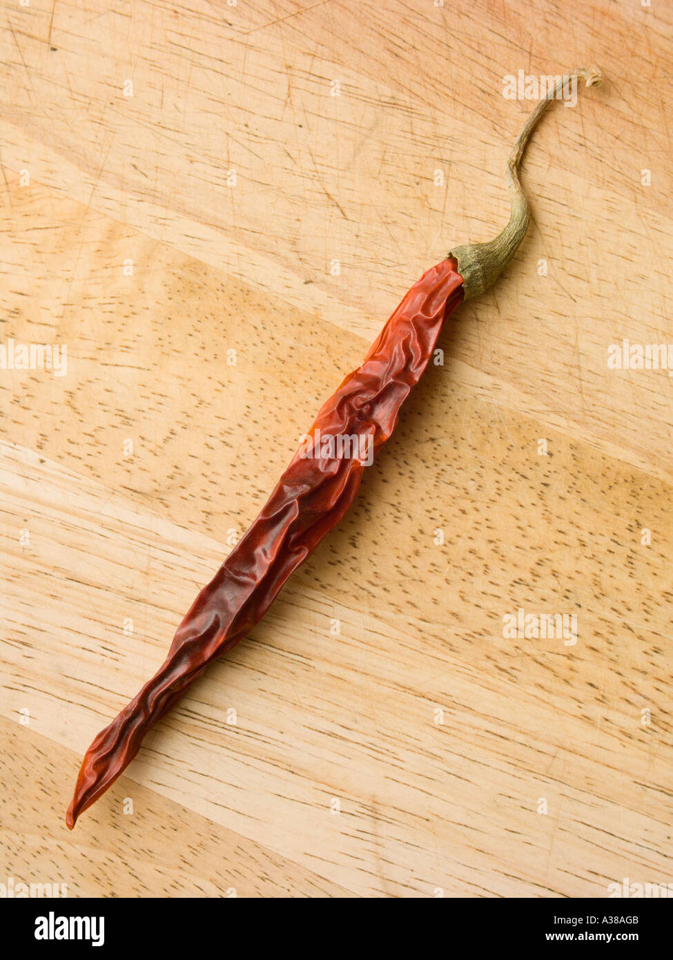 Sun dried chilli on a wooden board Stock Photo - Alamy