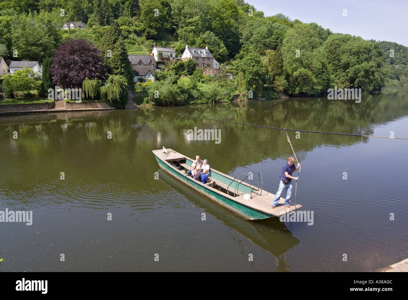 The ancient hand-pulled cable rope ferry crossing of the River Wye at ...