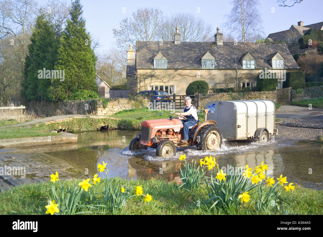 Crossing the ford on the River Eye in the Cotswold village of Upper ...