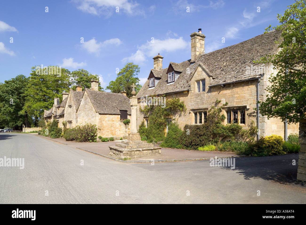 The cross outside Cross Cottage in the Cotswold village of Stanton ...