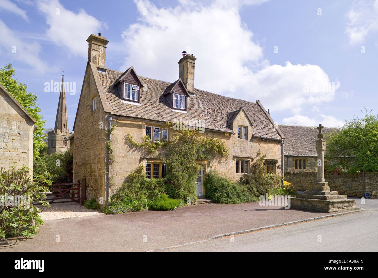 The cross outside Cross Cottage in the Cotswold village of Stanton ...