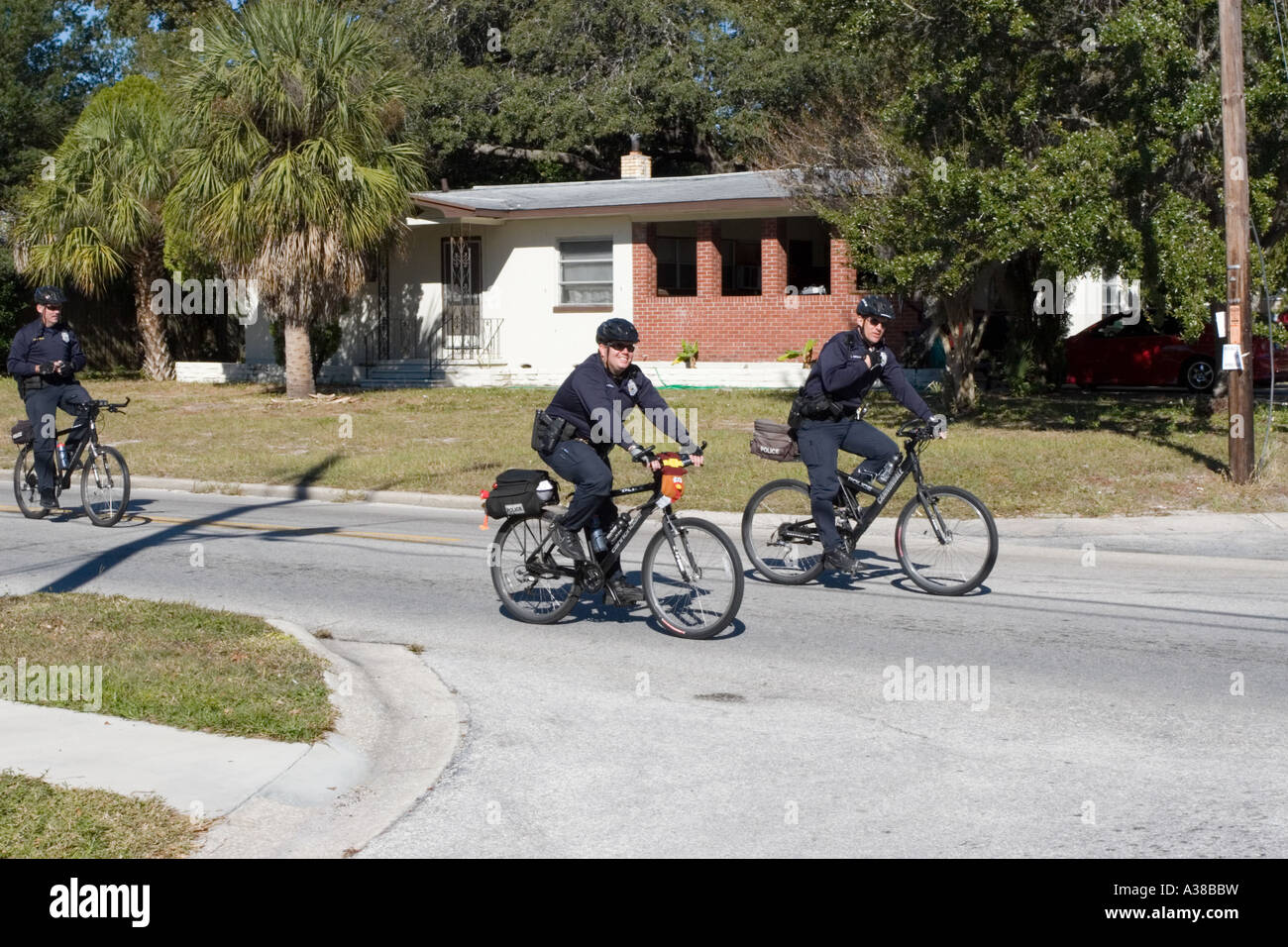 Two Bicycle Policeman Patrolling on a Residential Street Stock Photo ...