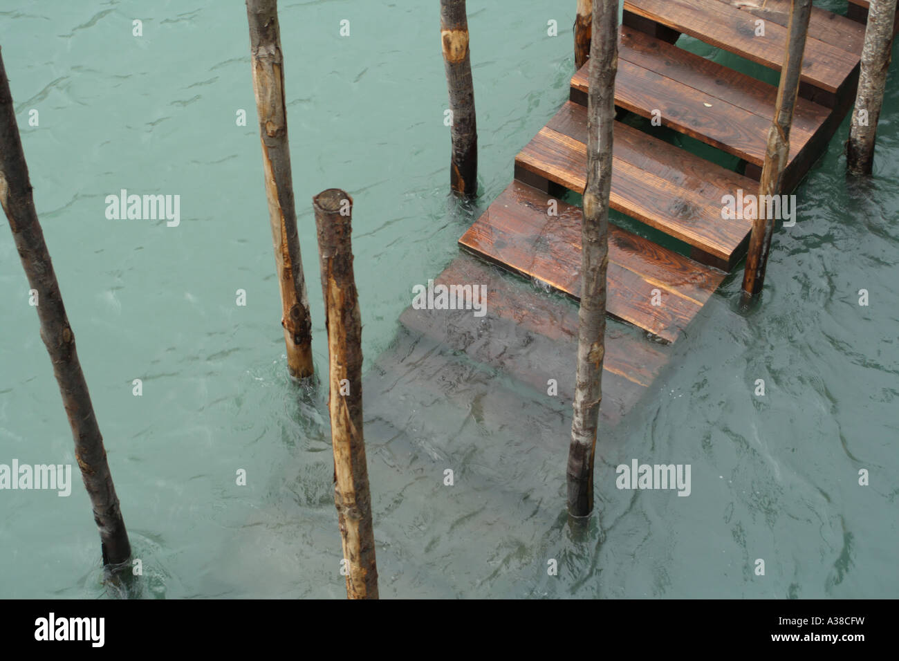 aqua alta water over steps to a gondala mooring Stock Photo - Alamy