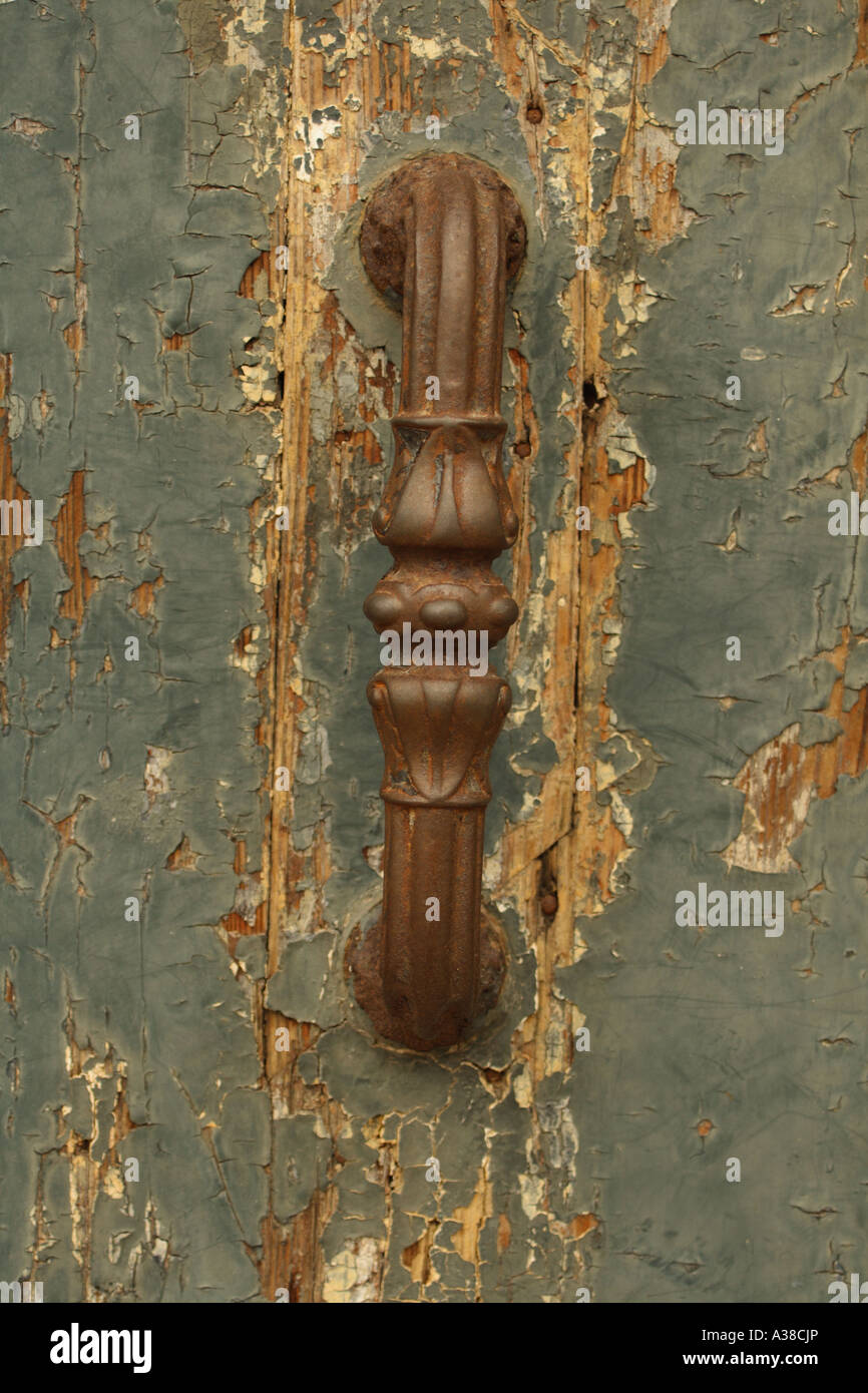 Old metal handle on a wooden door Stock Photo - Alamy