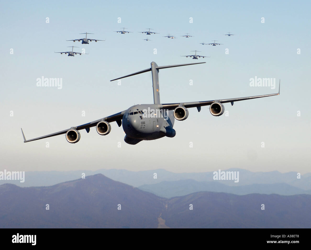 C 17 Globemaster III aircraft fly over the mountains Stock Photo - Alamy