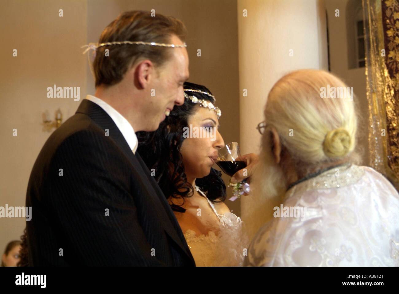 Bride drinking from the Common Cup during a Greek Orthodox wedding ...