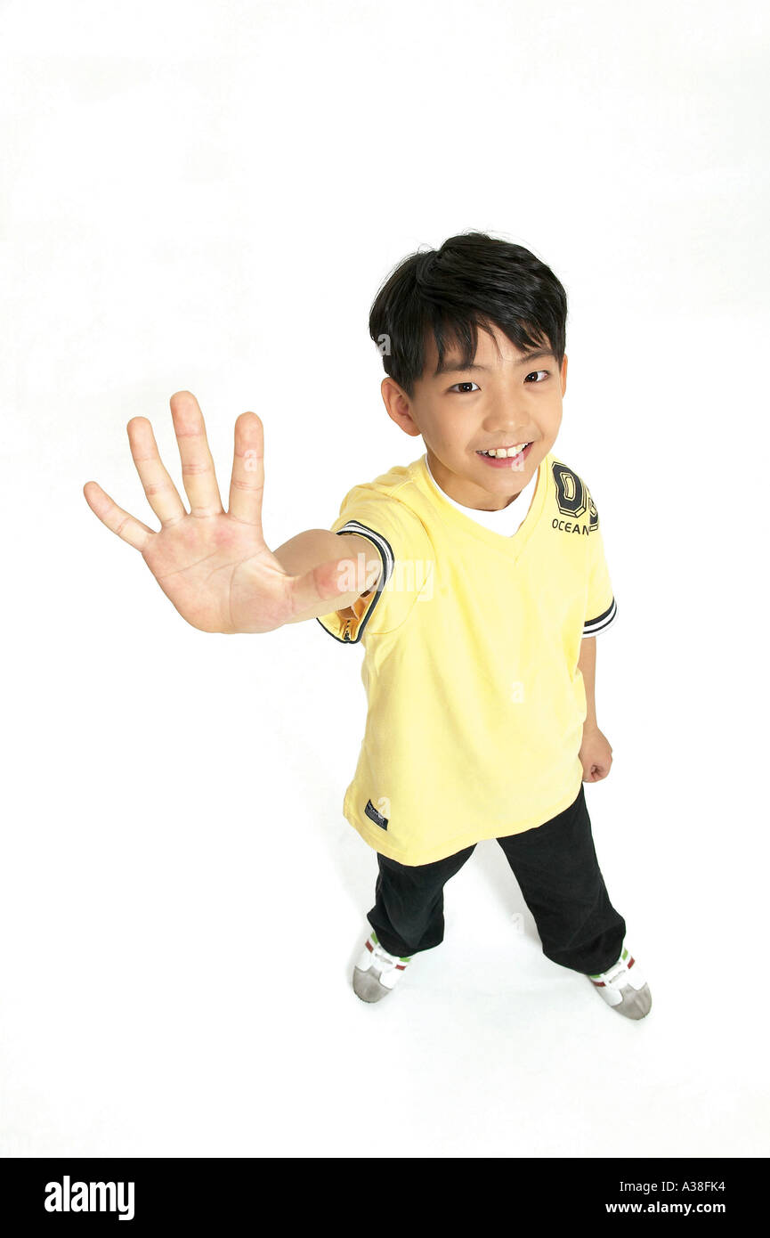 A school boy saying hello Stock Photo - Alamy