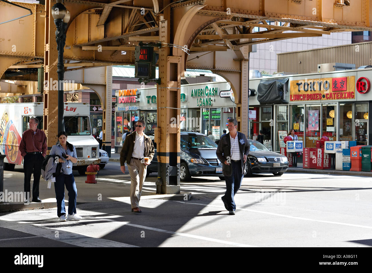 ILLINOIS Chicago Pedestrians in crosswalk under elevated train tracks ...