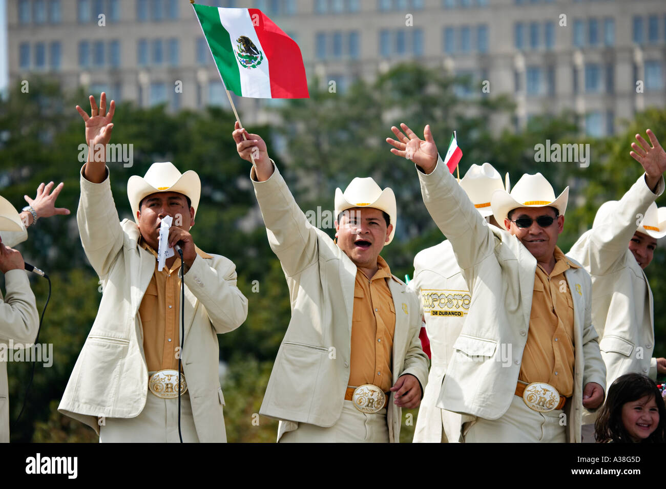 ILLINOIS Chicago Members of Hispanic singing group wave Mexican flag ...