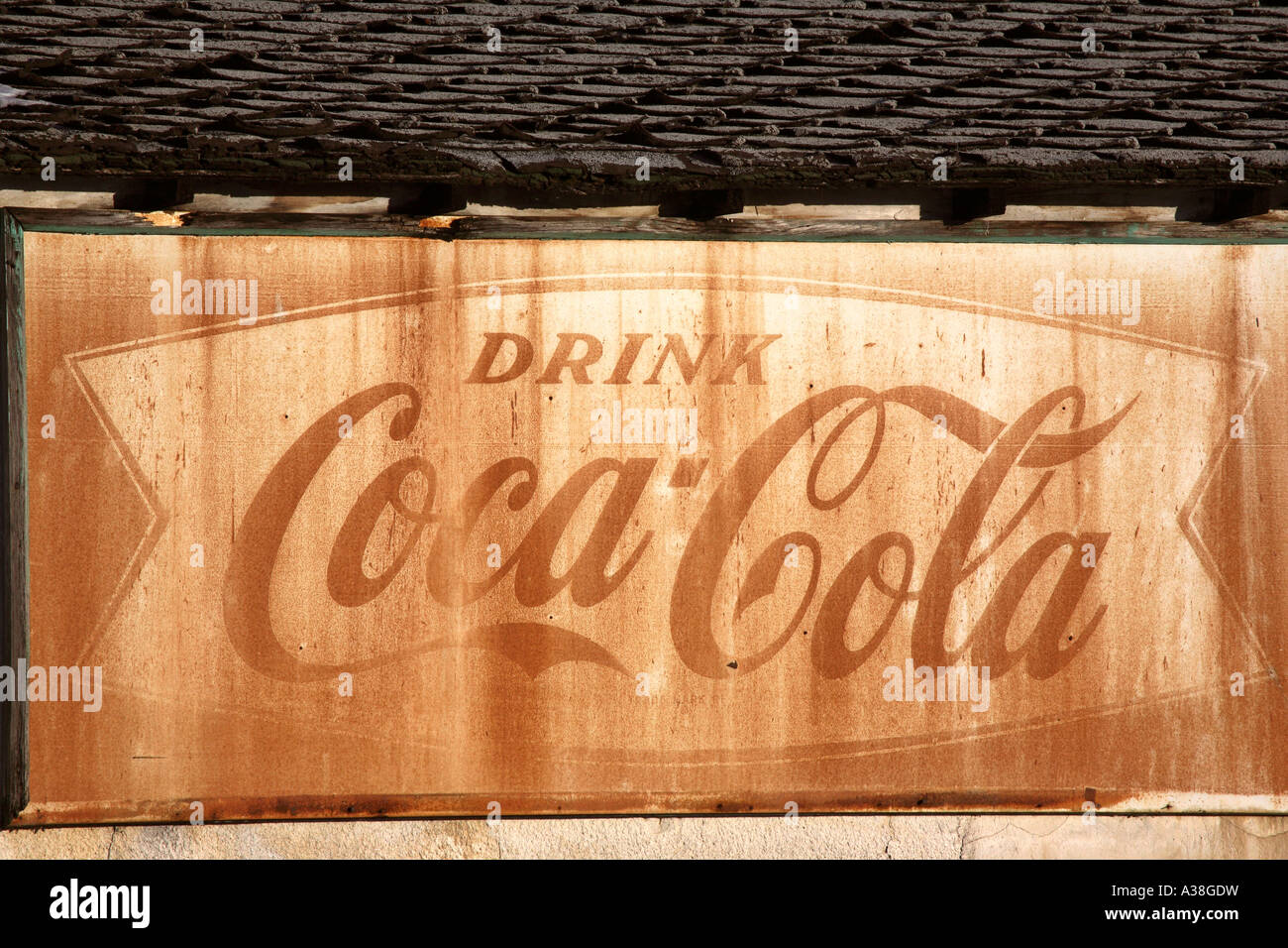 rusted sign on side of building Stock Photo - Alamy