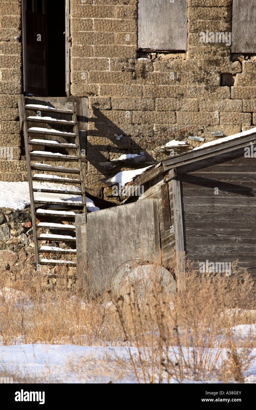 abandoned town building made from cinder block and a wooden shed in ...