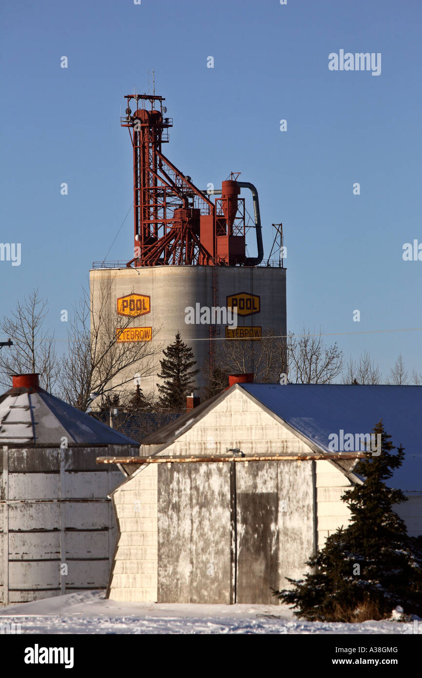 garage and grain bin with grain elevator in winter Stock Photo - Alamy