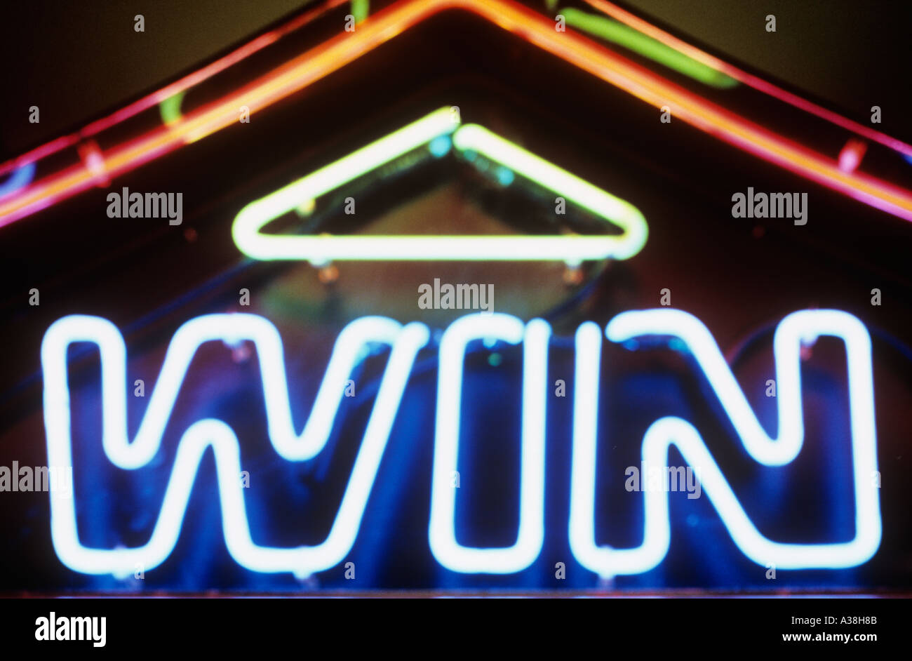 Blue red and green neon signs announcing Win Stock Photo - Alamy