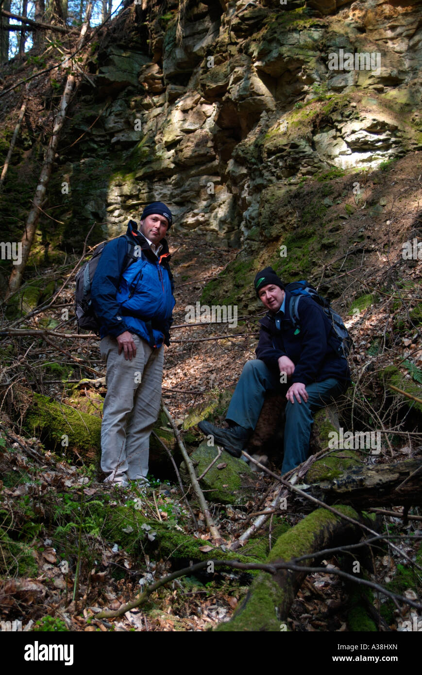 Walkers at the base of a cliff on the North York Moors Stock Photo - Alamy