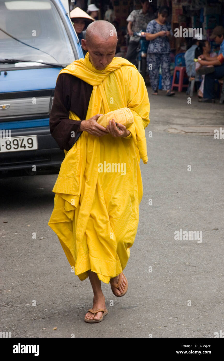 Buddhist monk with begging bowl in a street market in Saigon Stock ...