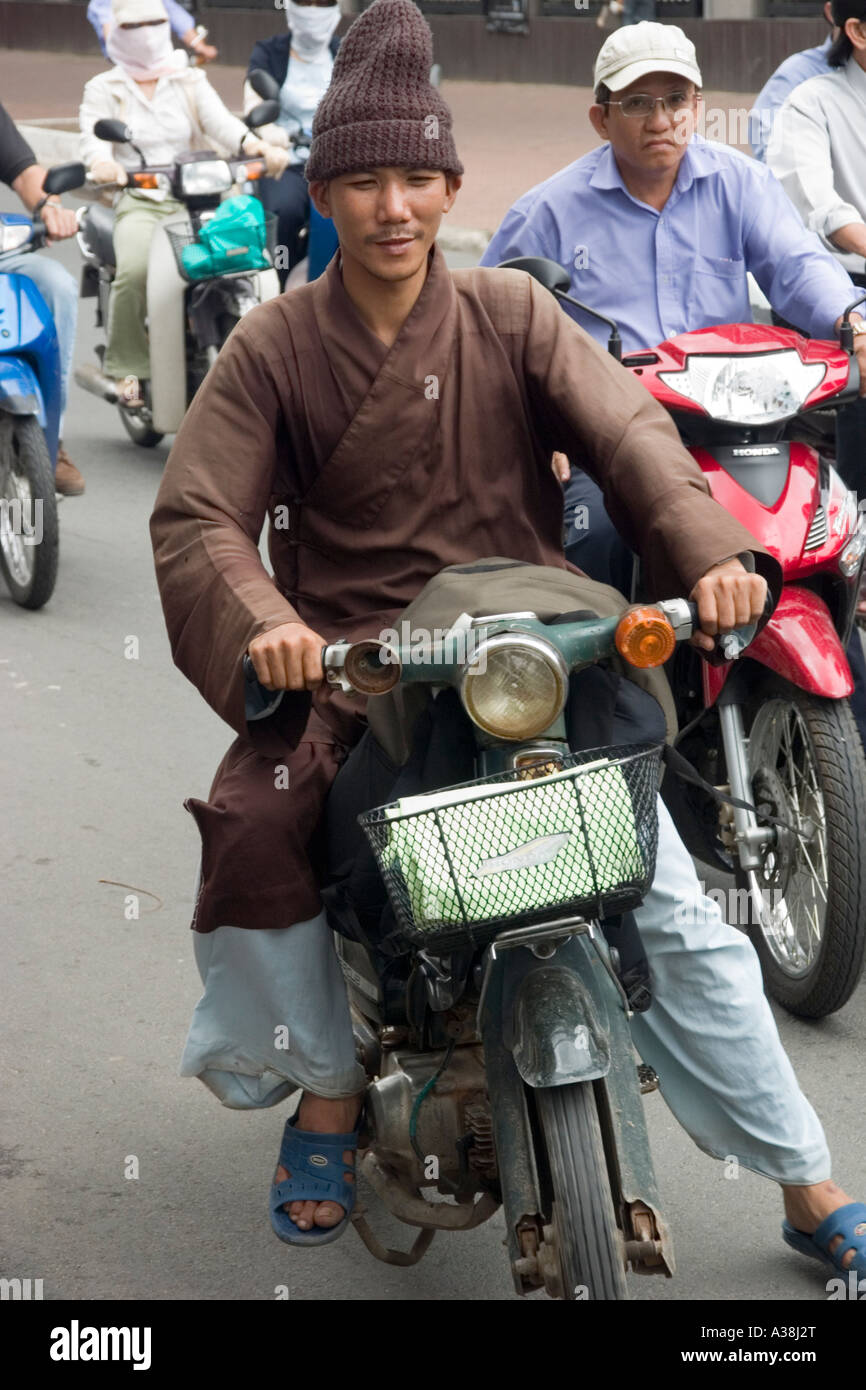 Monk on a motorcycle Saigon Stock Photo - Alamy