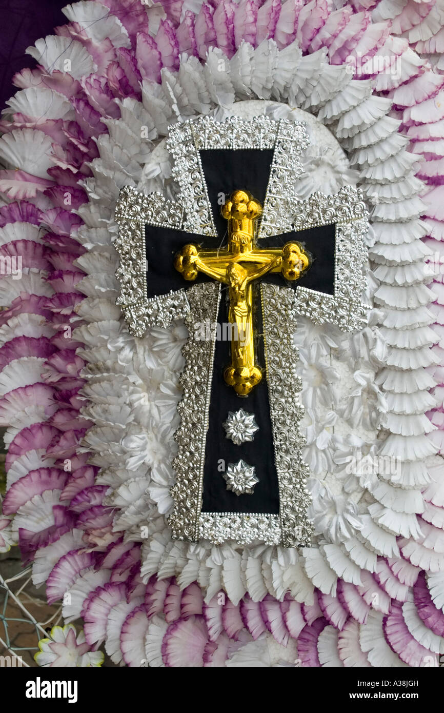 Crucifix funeral wreath in a Saigon shop Stock Photo - Alamy