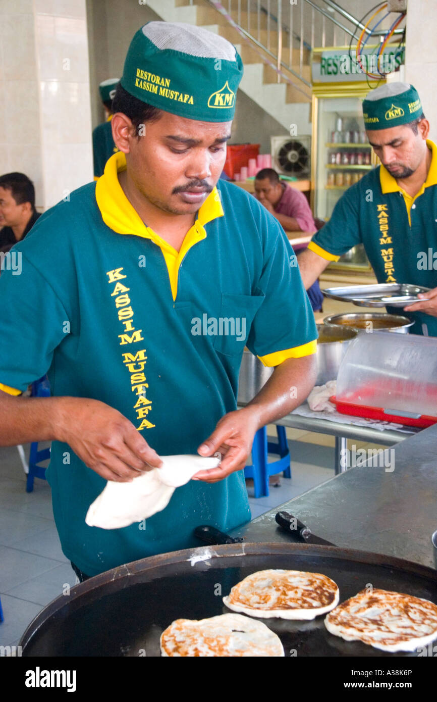 Men making roti canai chennai in Georgetown Penang Stock Photo - Alamy
