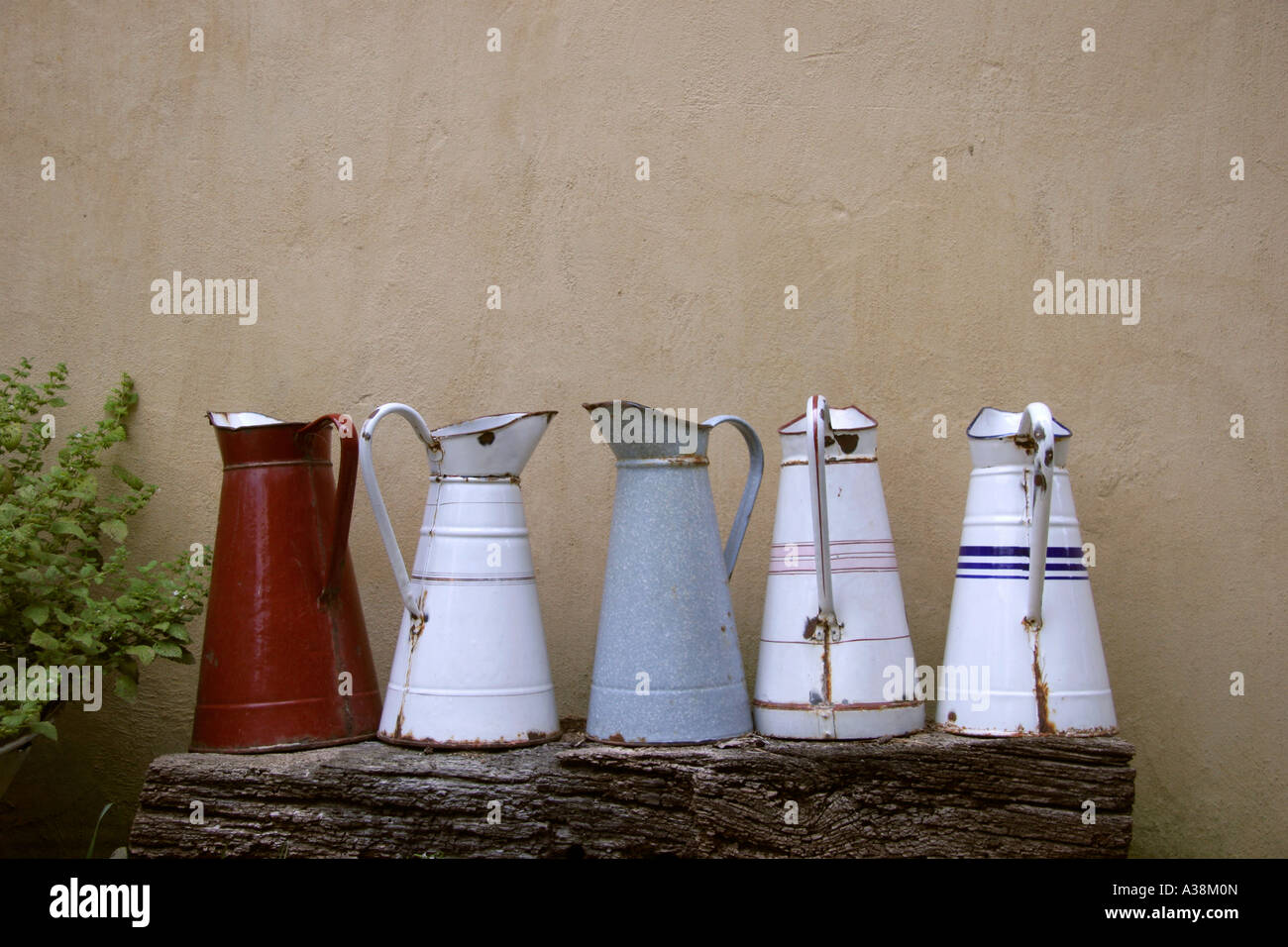 Traditional old milk jugs at a farm shop in Le Gers, Midi-Pyrenees ...