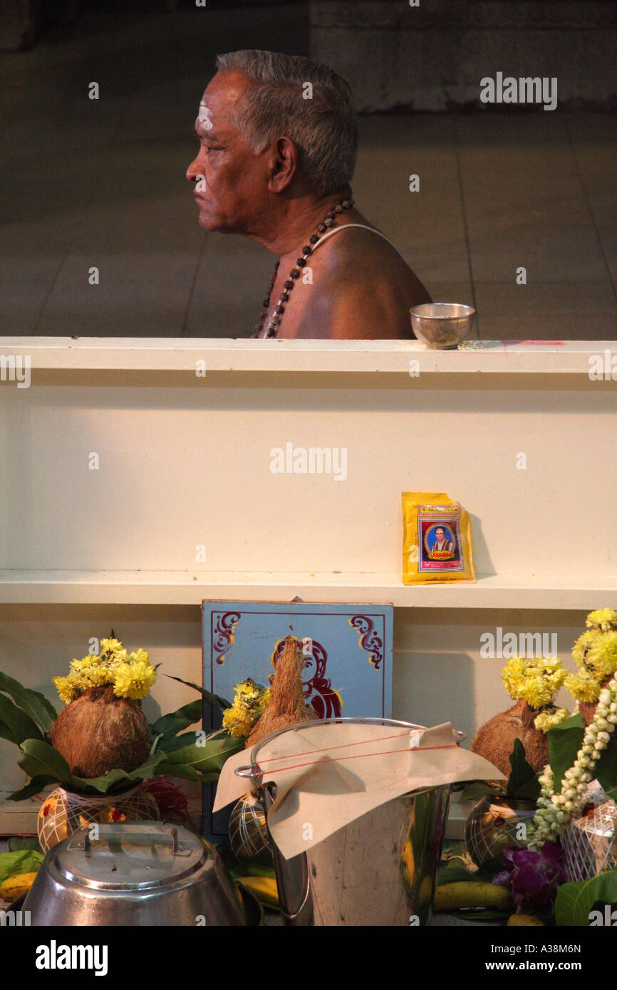Holy man praying inside the Hindu Sri Veeramakaliamman Temple, Little ...