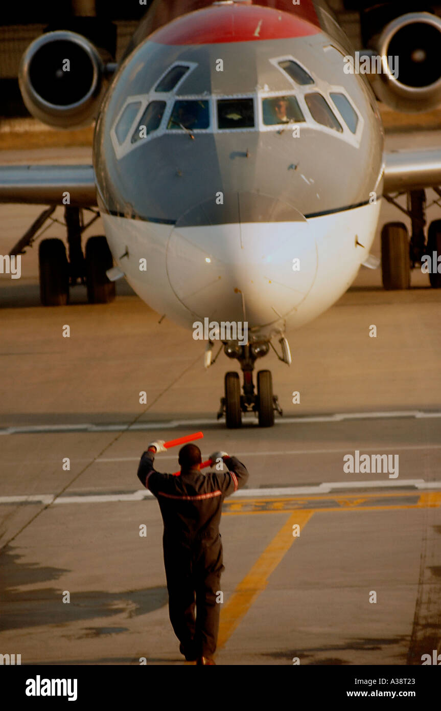 Ground crewman directing an aircraft before takeoff Stock Photo - Alamy