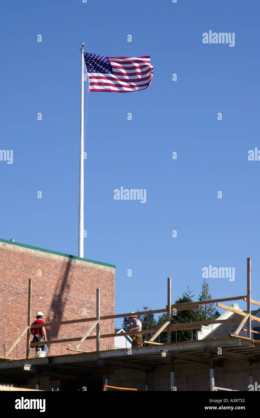 Construction workers an american flag hi-res stock photography and ...