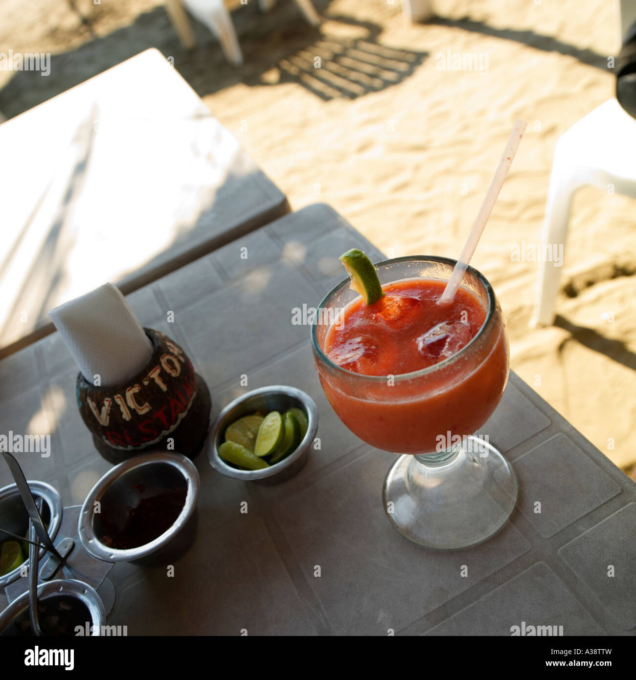 A refreshing fruit cocktail on a beach table Stoen Island Mazatlan ...