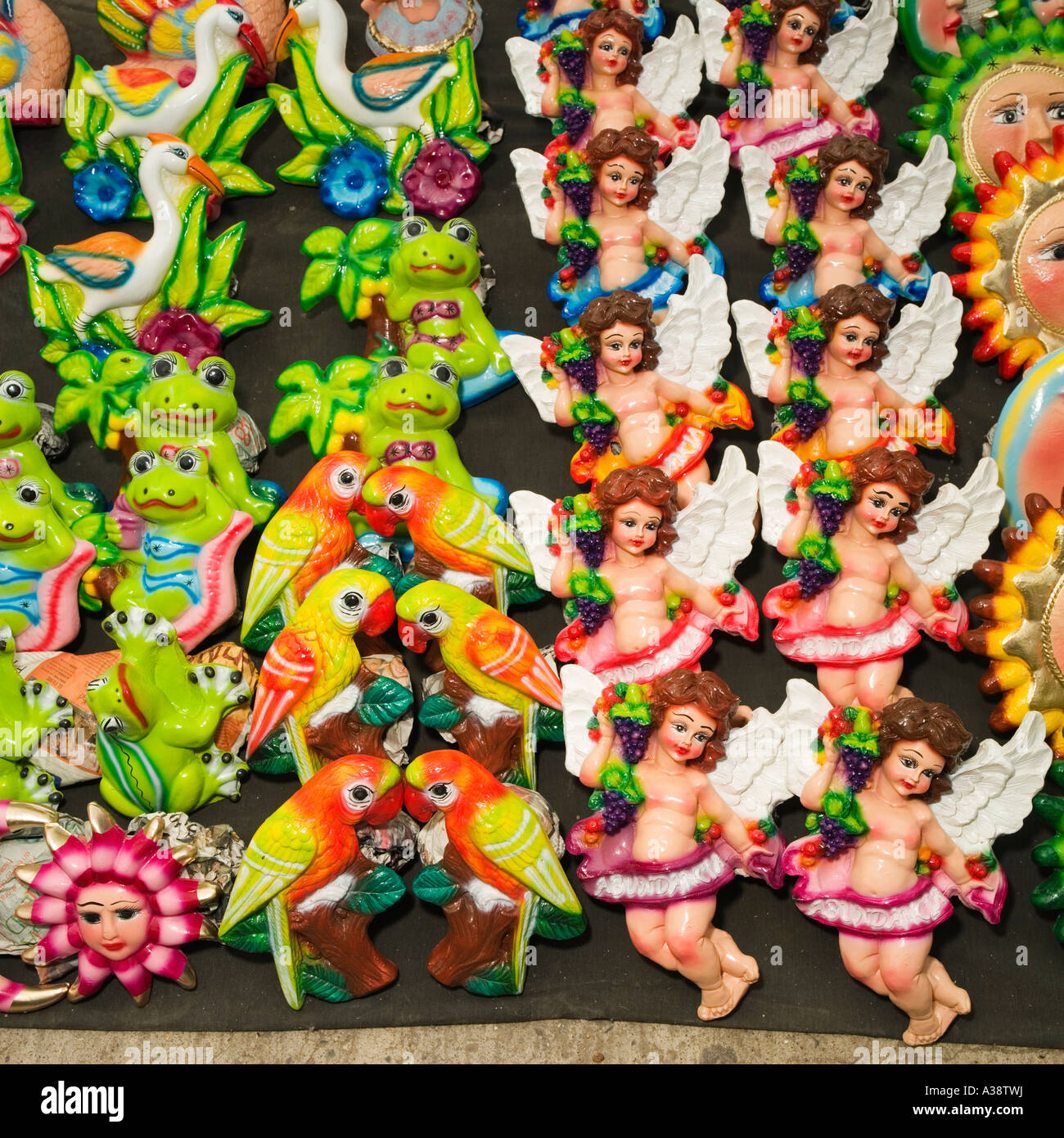 Plaster angels frogs and other characters on sale at an outdoor market ...