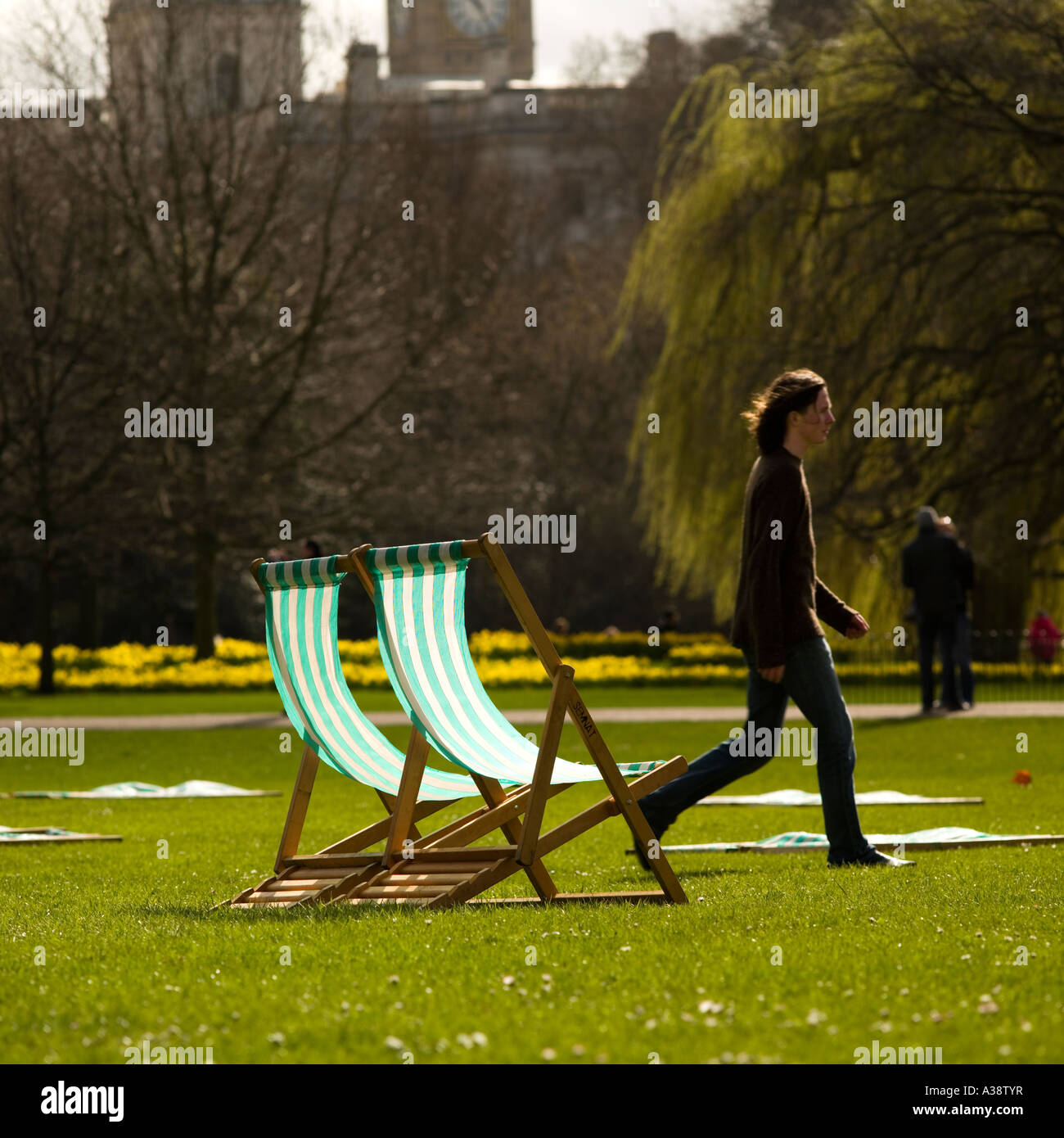 student in the middle of setting out Green folding chairs St. James ...