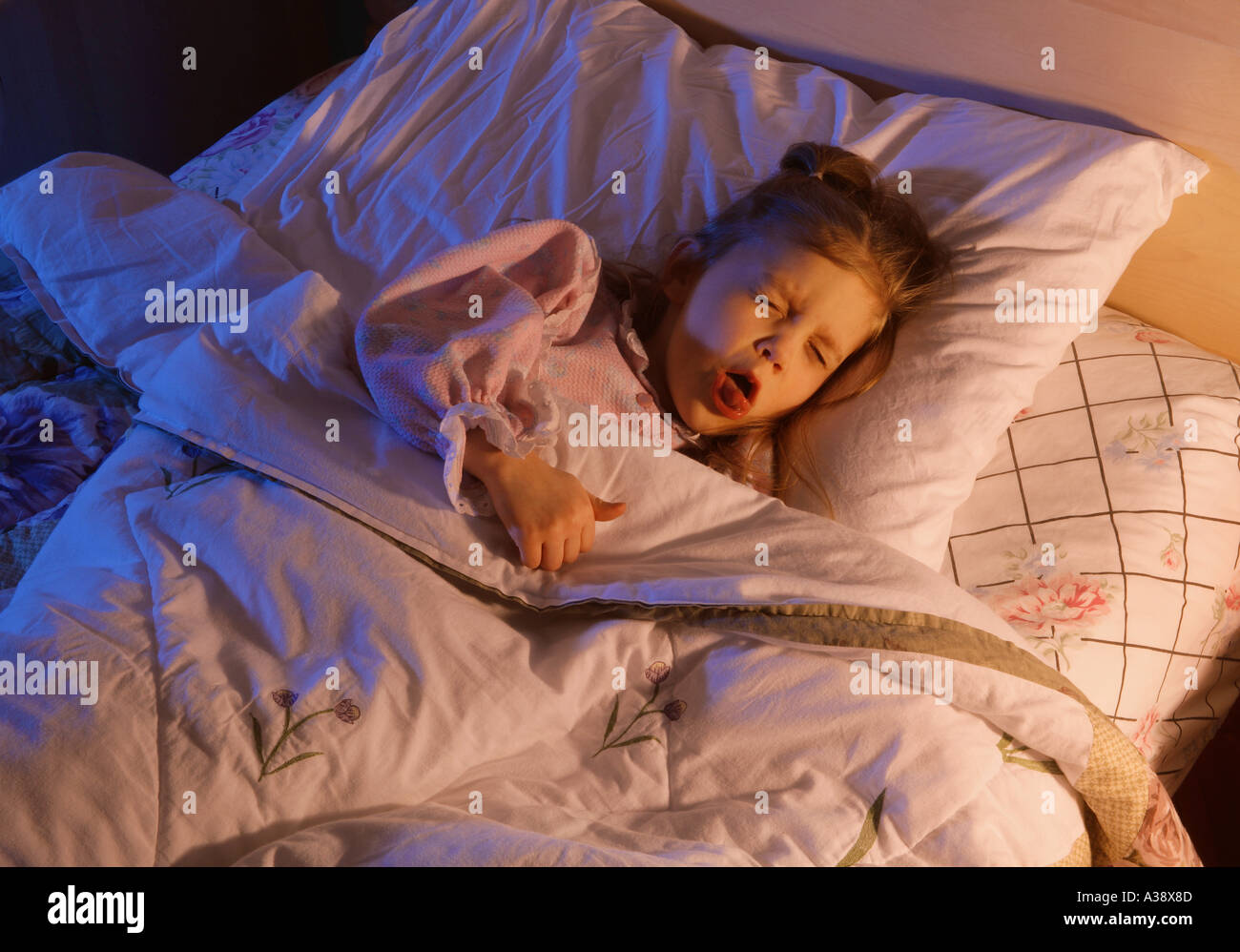 Sick child in bed Stock Photo - Alamy