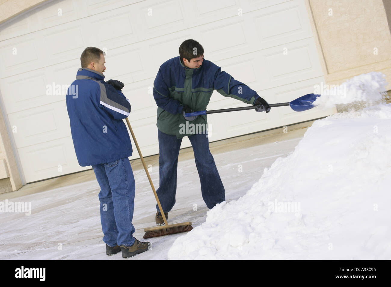 Man shoveling driveway Stock Photo - Alamy