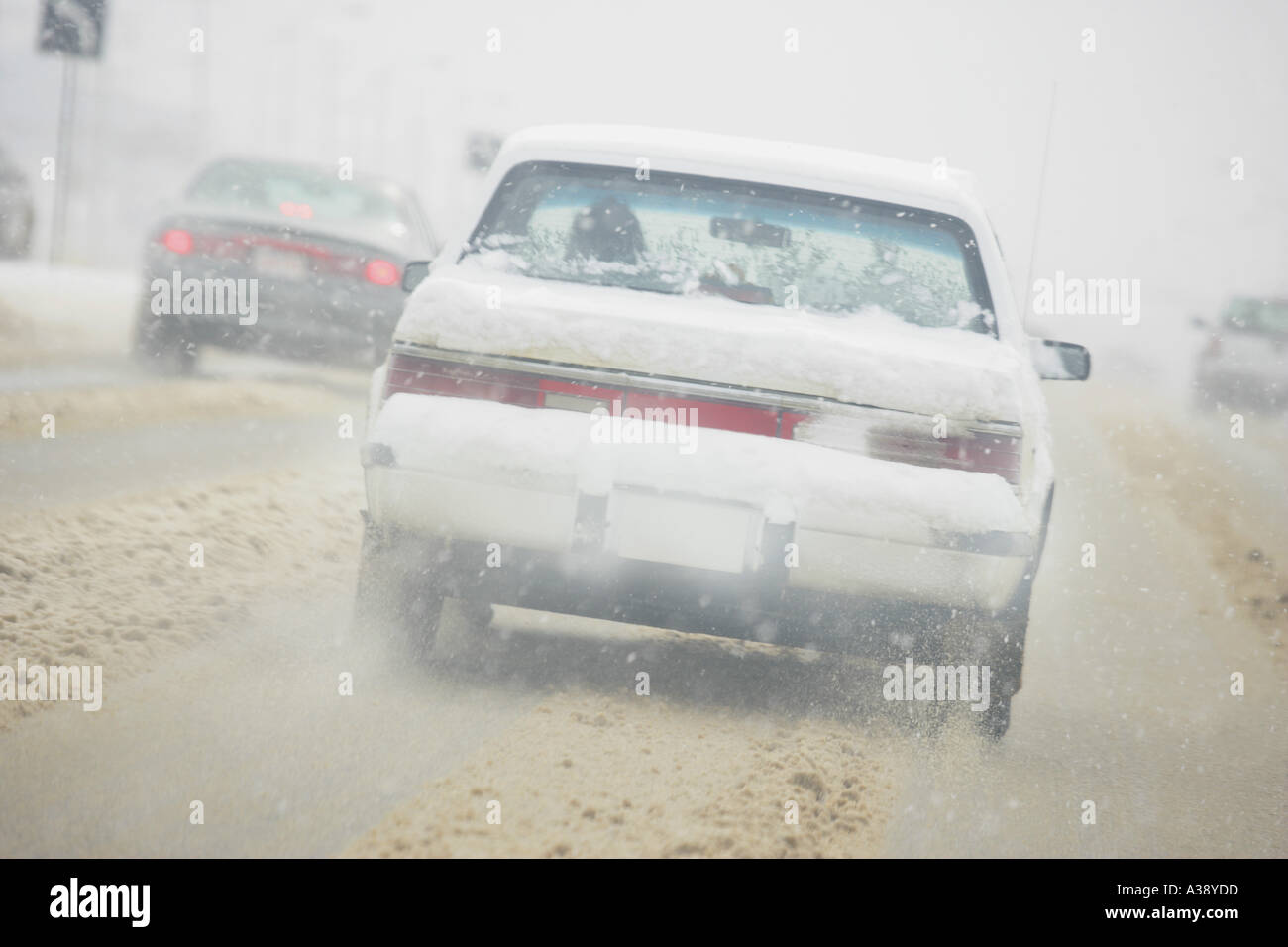 Traffic on slushy road Stock Photo - Alamy