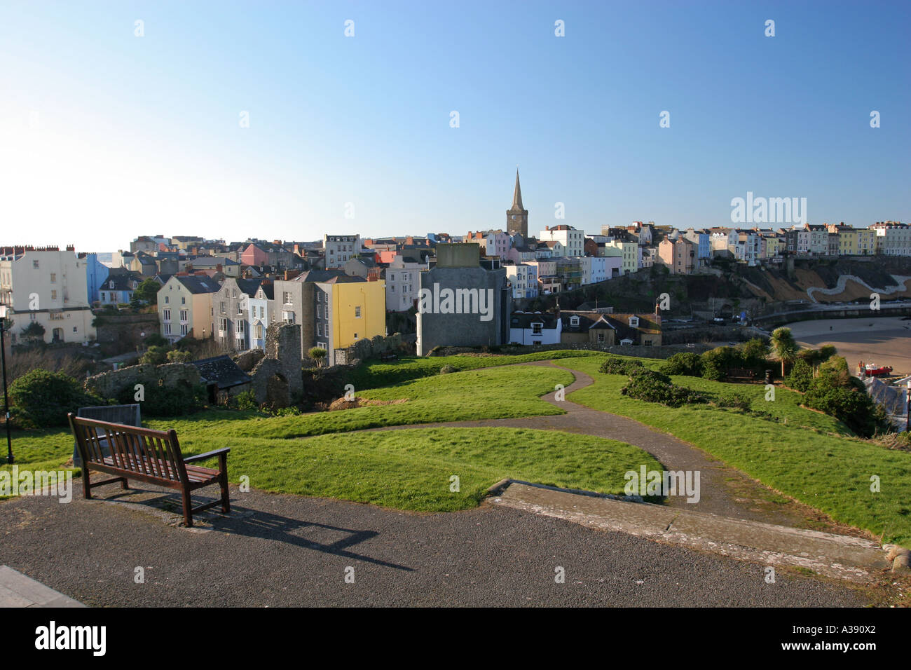 The spire of St Mary s Church Tenby dominates the colourful skyline of ...