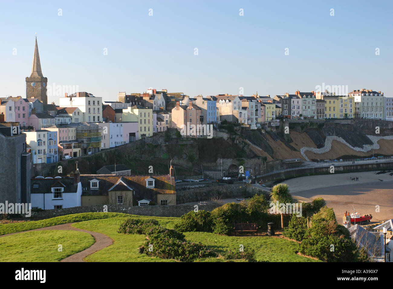 The spire of St Mary s Church Tenby dominates the colourful skyline of ...