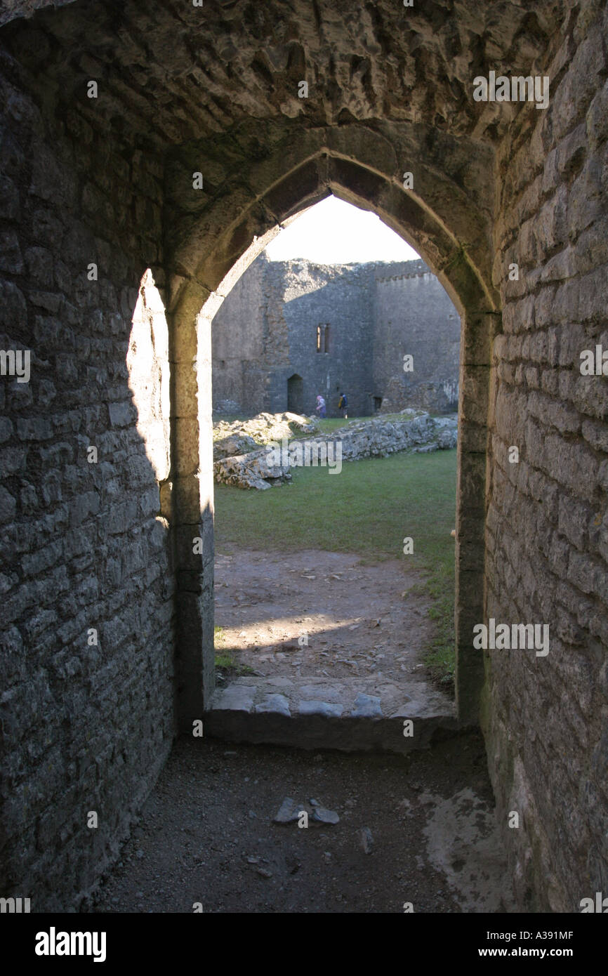Small arched stone doorway and corridor inside Carreg Cennen castle ...