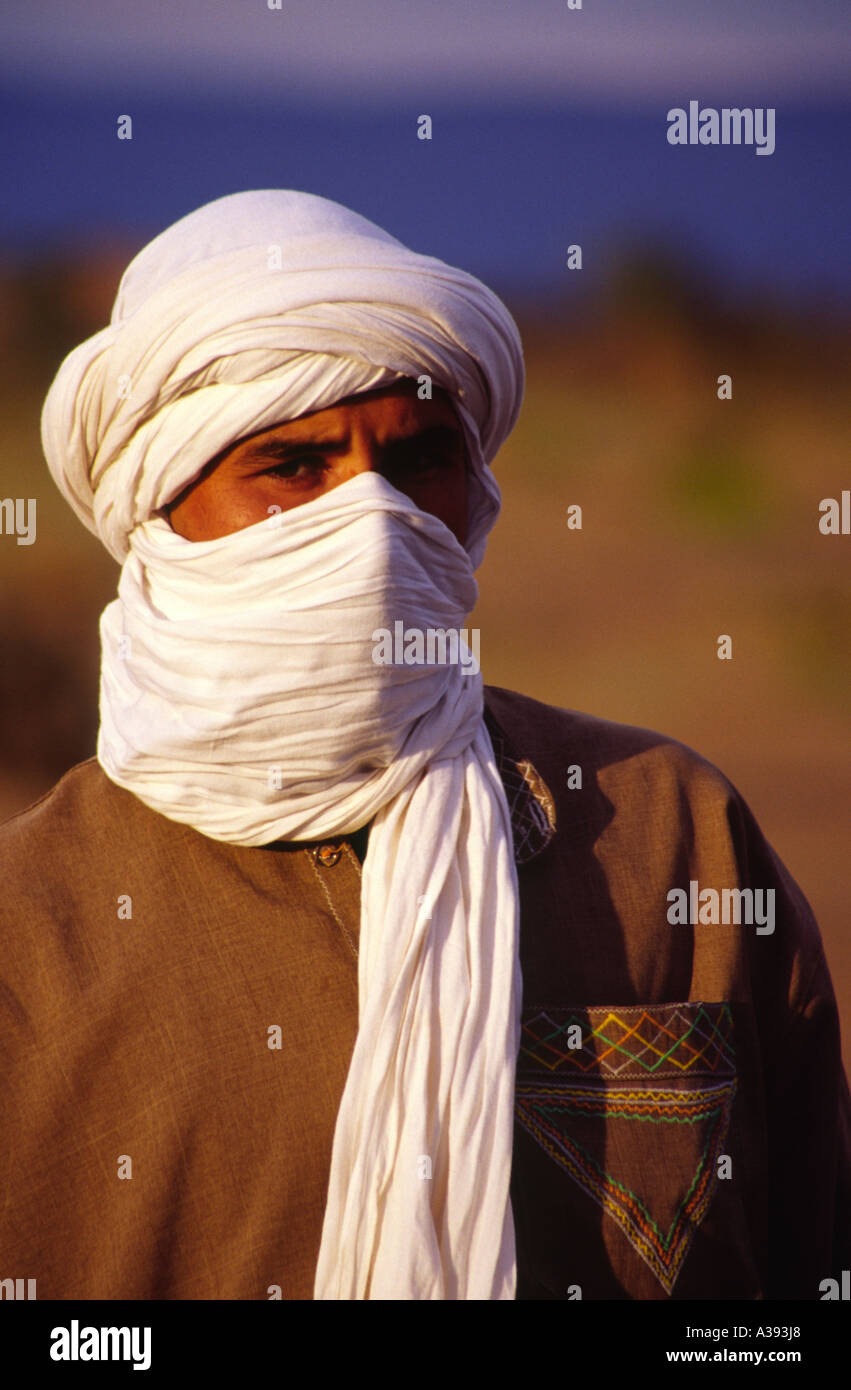 Handsome young man in the desert wearing traditional turban, Morocco ...