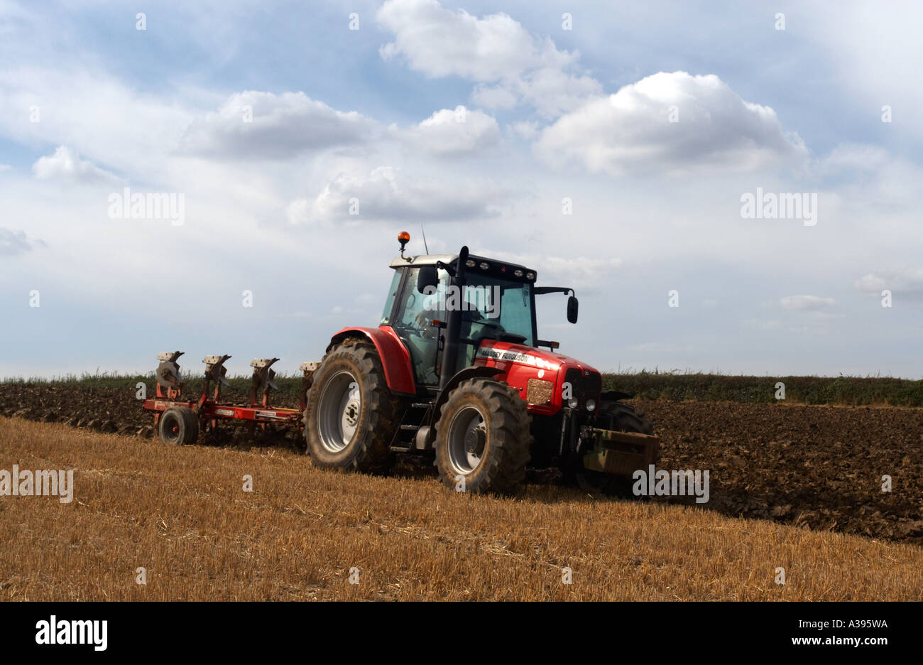 Tractor and Plough Stock Photo - Alamy