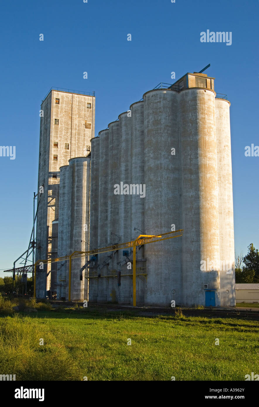 Grain storage complex along railroad tracks in rural Illinois Stock ...
