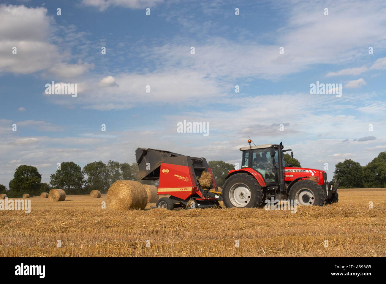 Tractor and Baler Stock Photo - Alamy