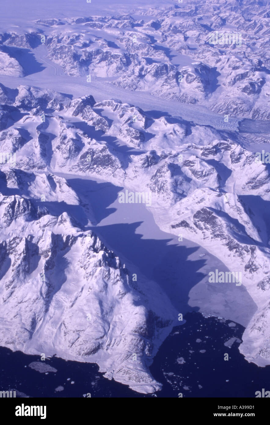 Greenland coastline with mountain shadows and glacier Stock Photo - Alamy