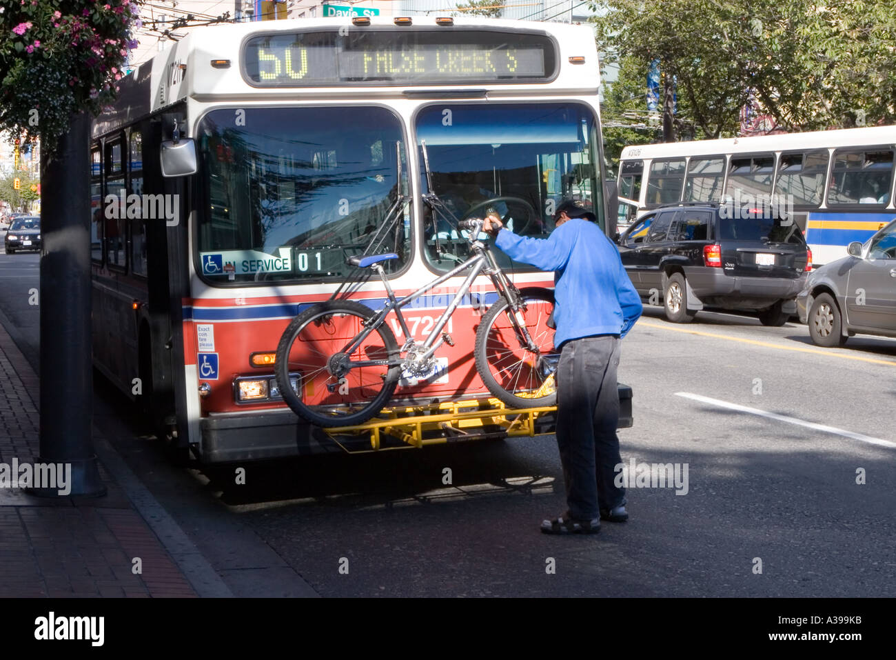 A biker getting on the bus Stock Photo - Alamy