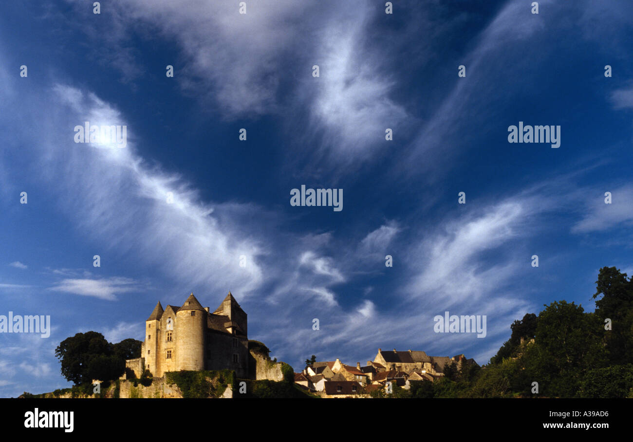 The chateau and village of Salignac under a dramatic summer sky ...