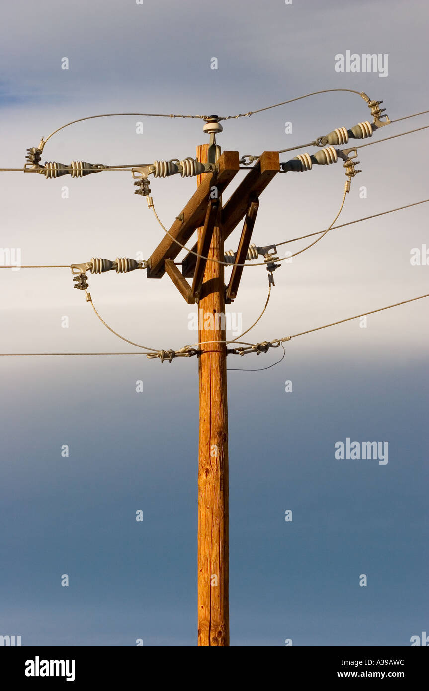 Utility pole against cool blue sky Stock Photo - Alamy