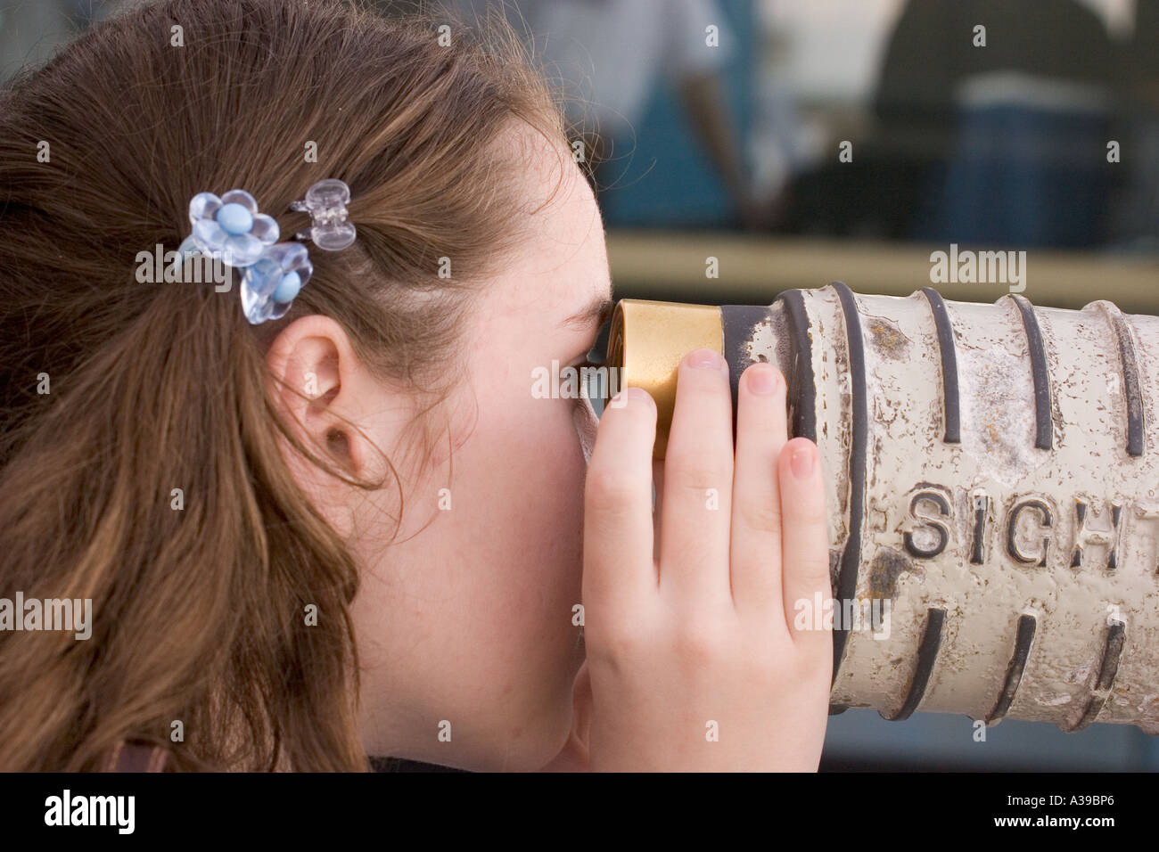 Small child looking through telescope hi-res stock photography and ...