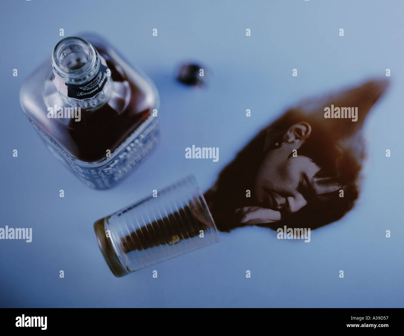 Man reflects himself in Spilled Puddle of Whiskey Symbol for Disturbed ...