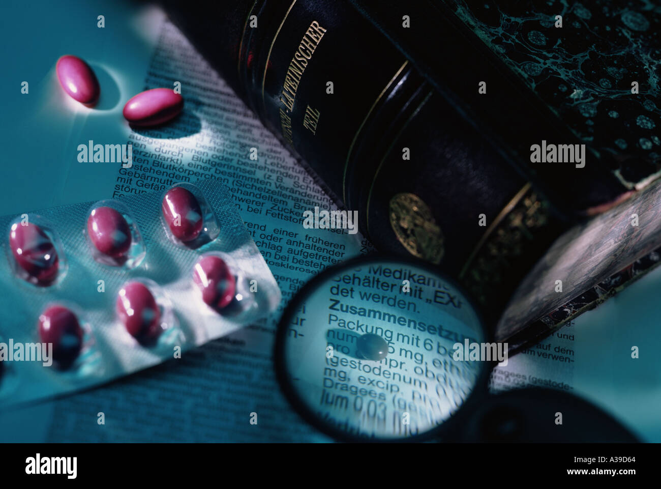 Pills with Packing Supplement Magnifying Glass over Little Letter Text ...