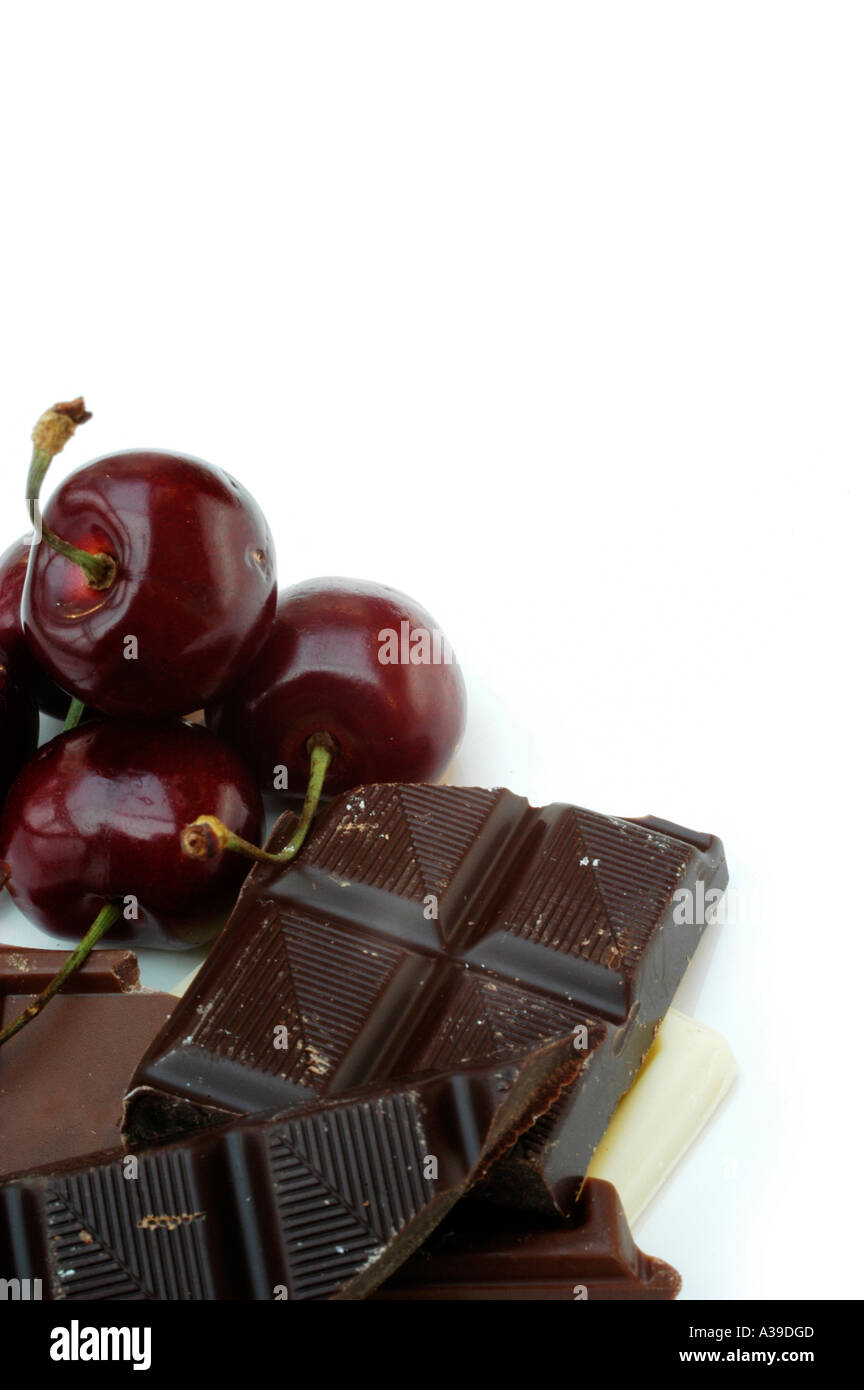 Cherries and chocolate on a white background Stock Photo - Alamy