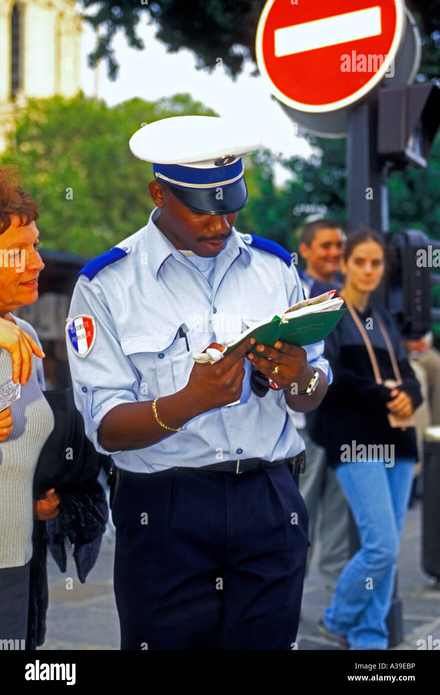 French policeman, policeman, giving directions to tourist, tourist ...