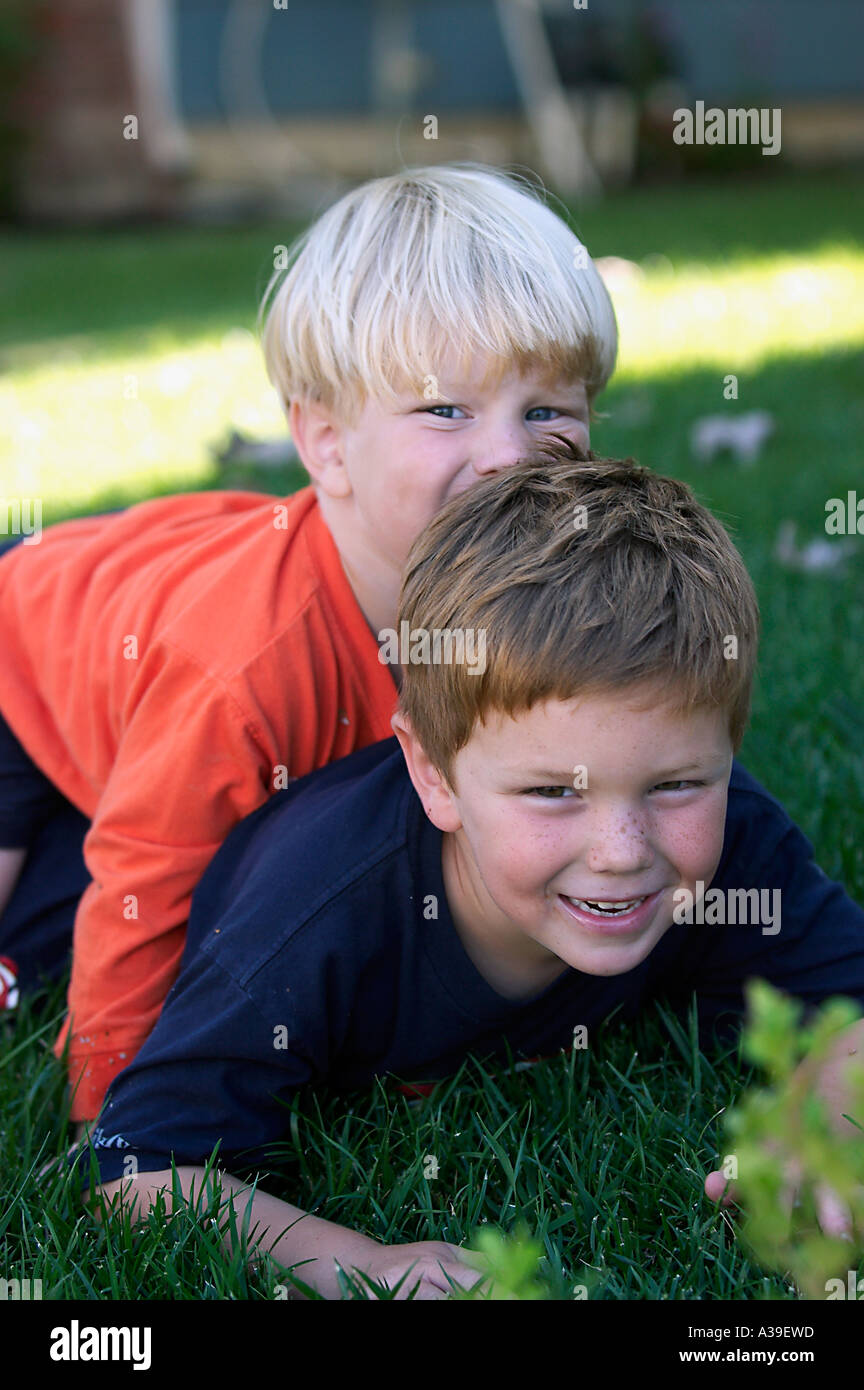 brothers on the grass Stock Photo - Alamy