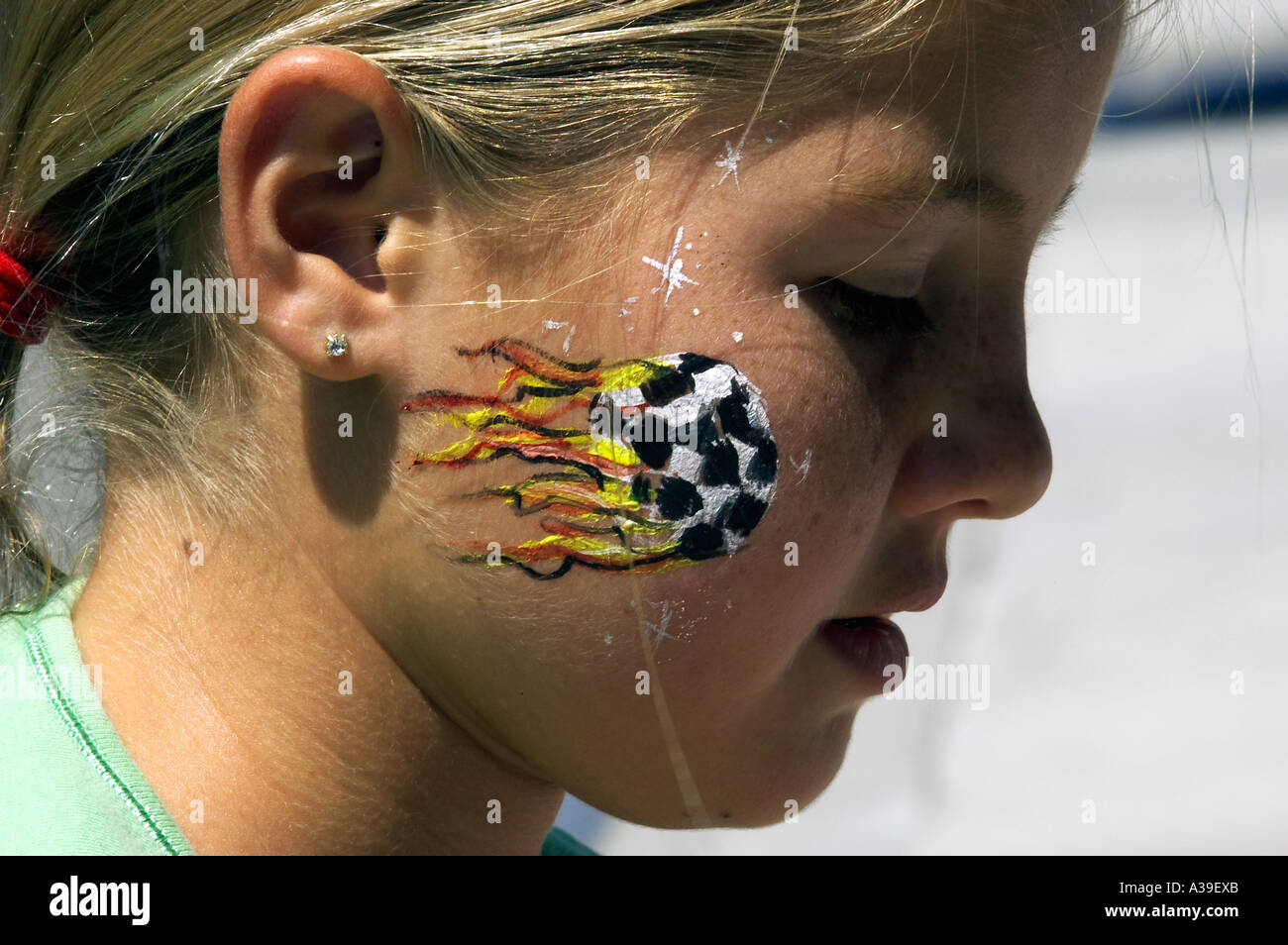 girl with soccer face paint Stock Photo - Alamy